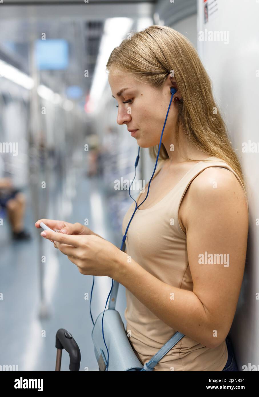 Woman coach suitcase hi-res stock photography and images - Alamy