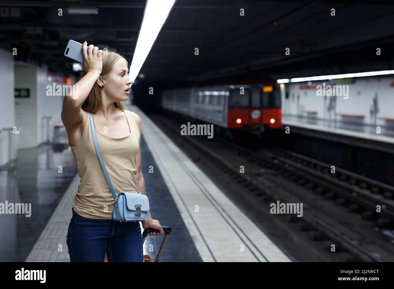 Female tourist on subway hi-res stock photography and images - Alamy