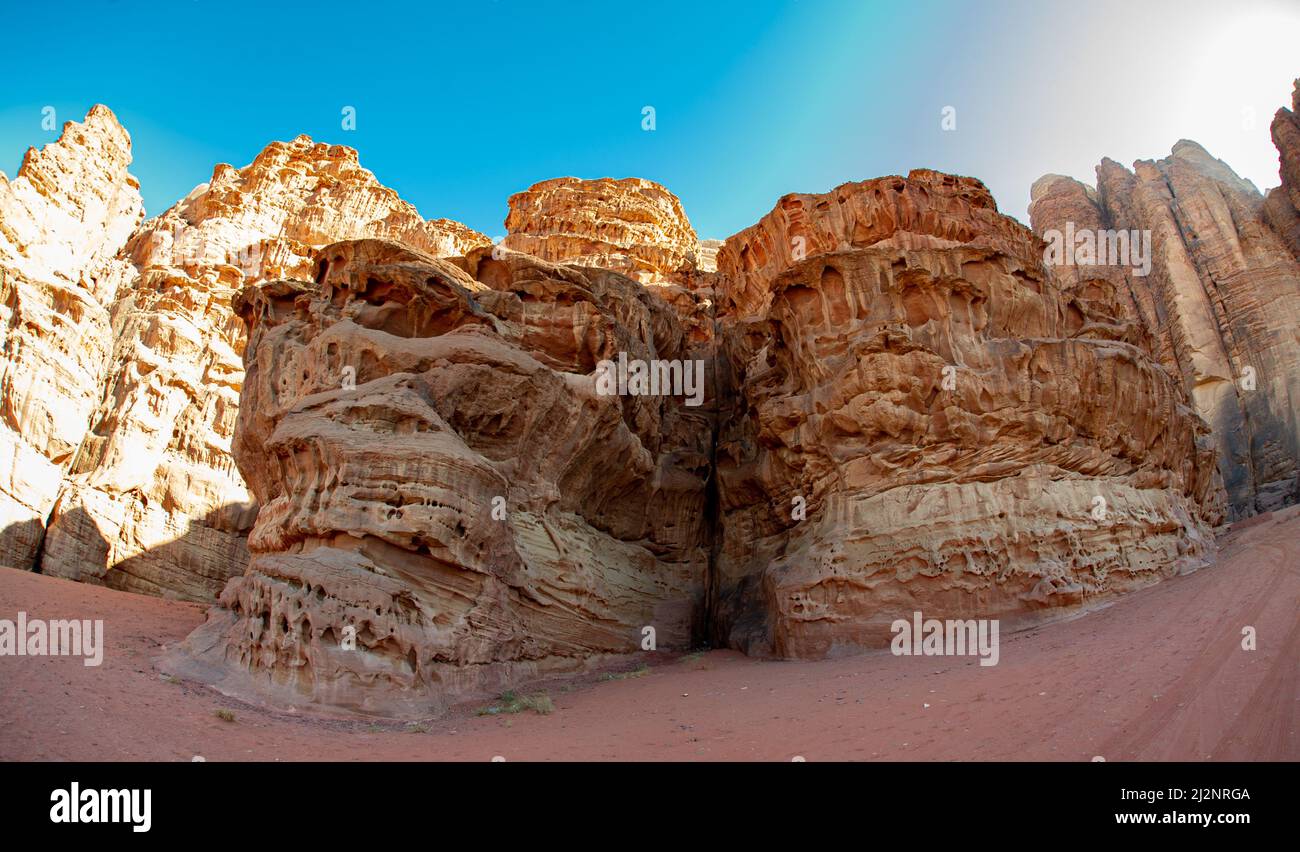 Wadi Rum rocky desert with red sand and red rocky mountains, sand dunes ...