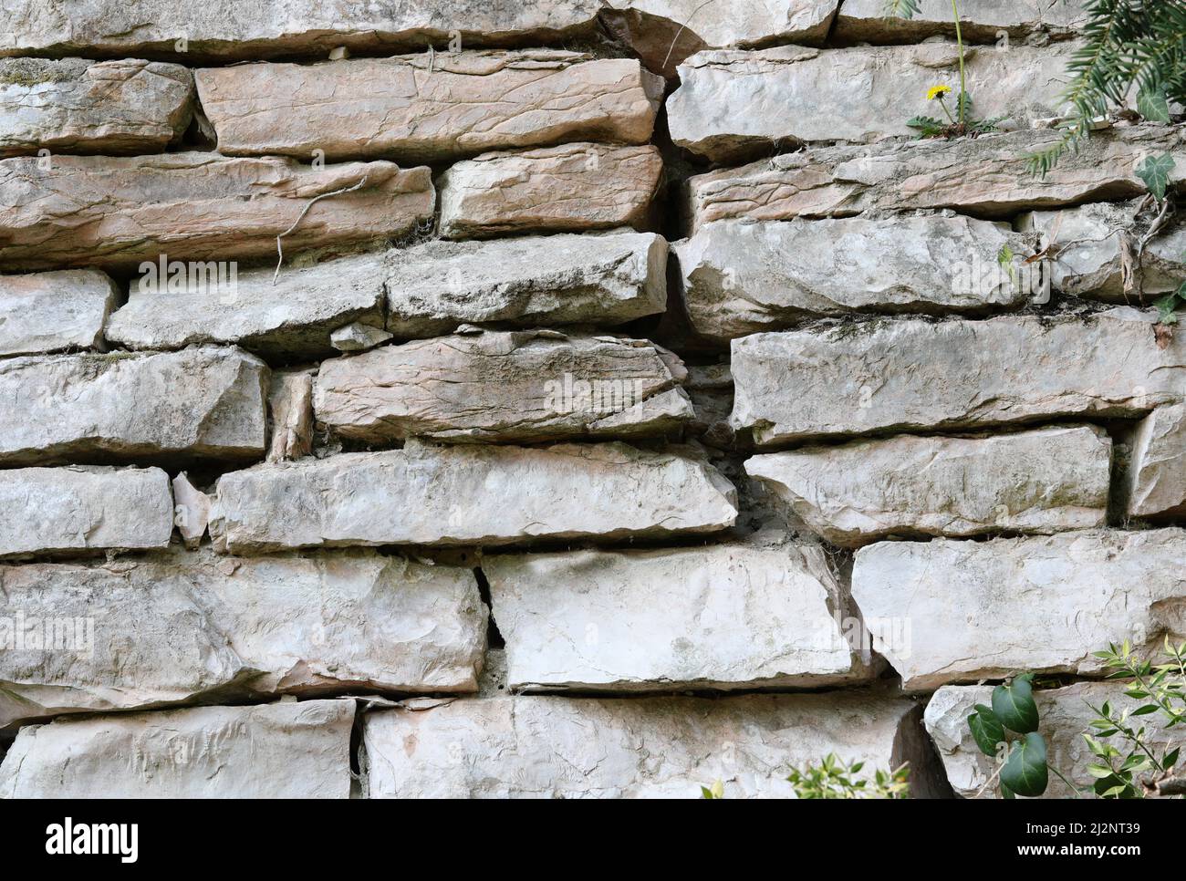 many layers of rock in a horizontal position that form a wall to ...