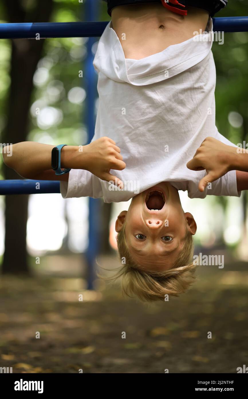 Hanging upside down by feet hi-res stock photography and images - Alamy