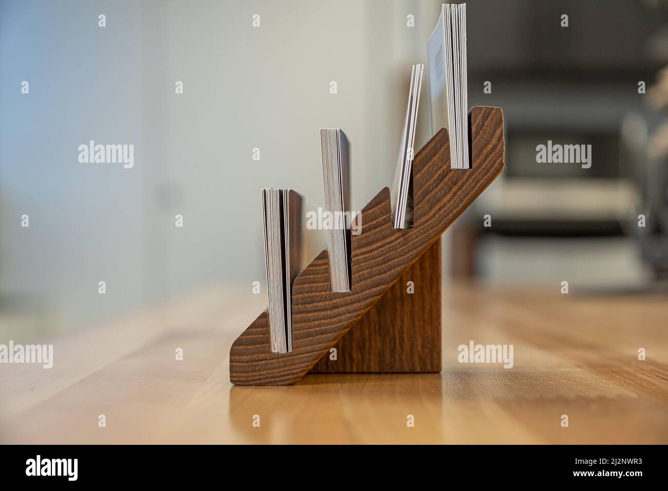 Wood business card holder on office table at work Stock Photo - Alamy