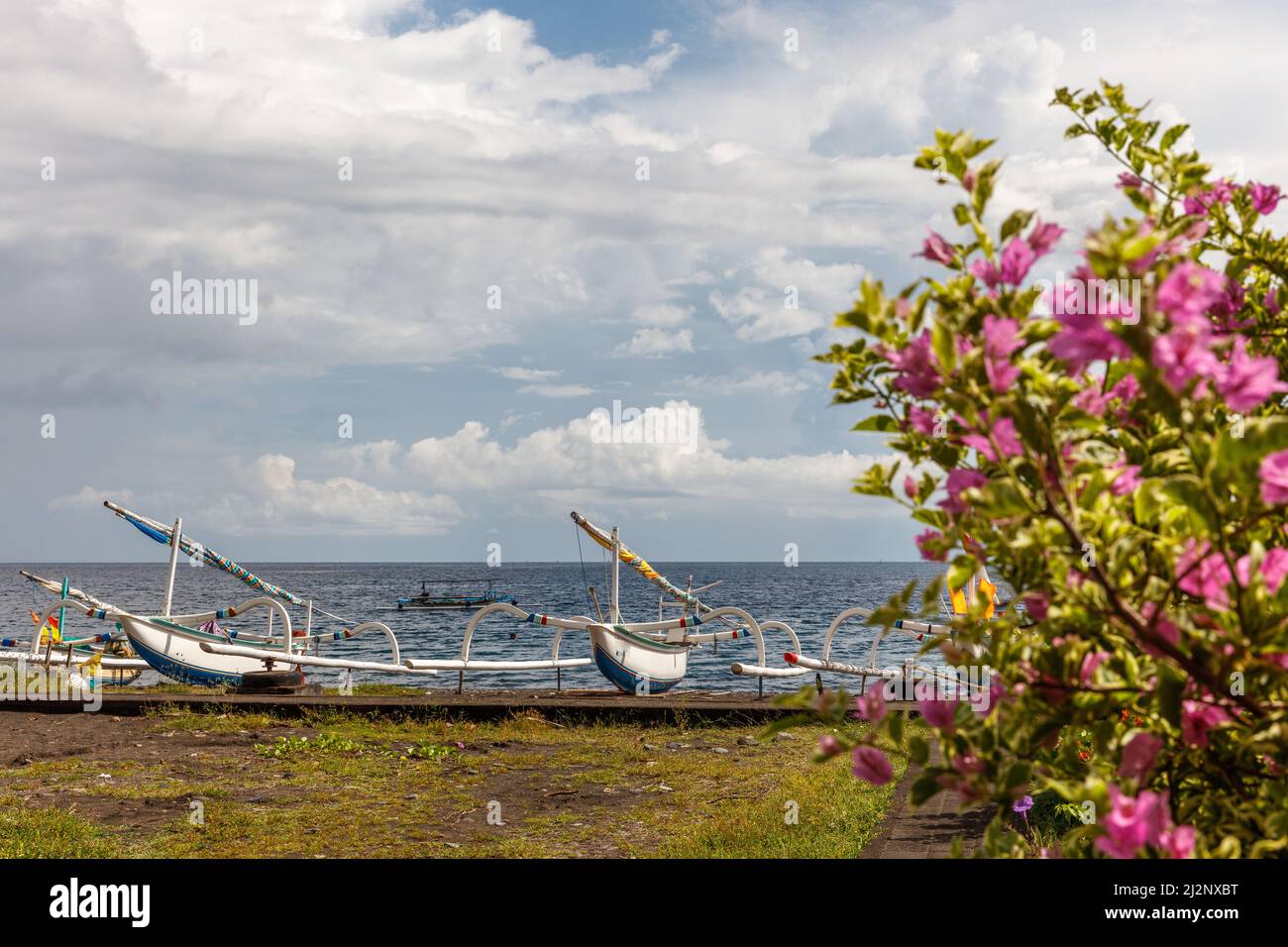Views of Amed - ocean, blooming bougainvillea. Karangasem Regency, Bali ...