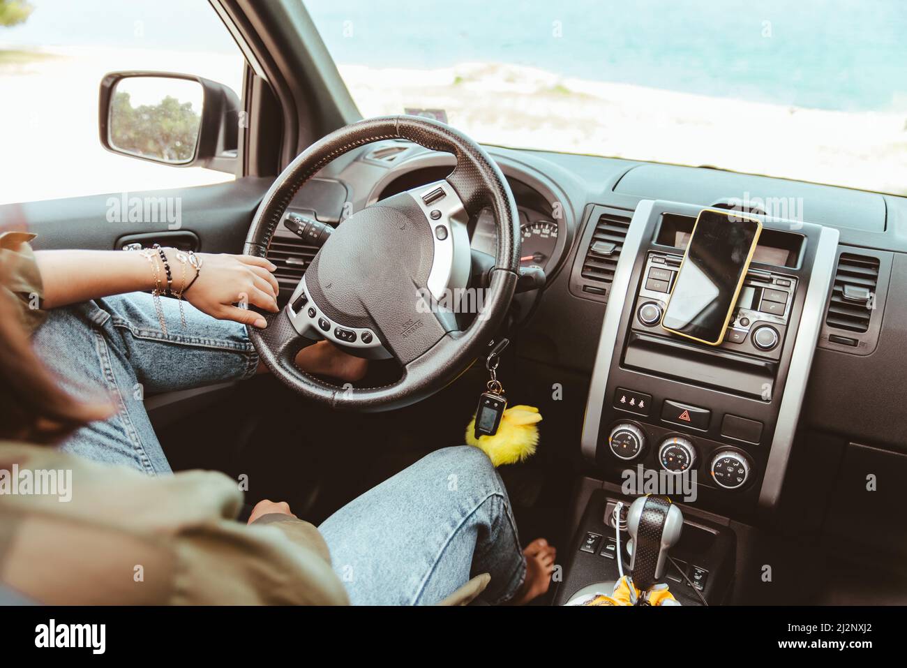 relaxed woman in car. road trip. summer time. steering wheel Stock ...