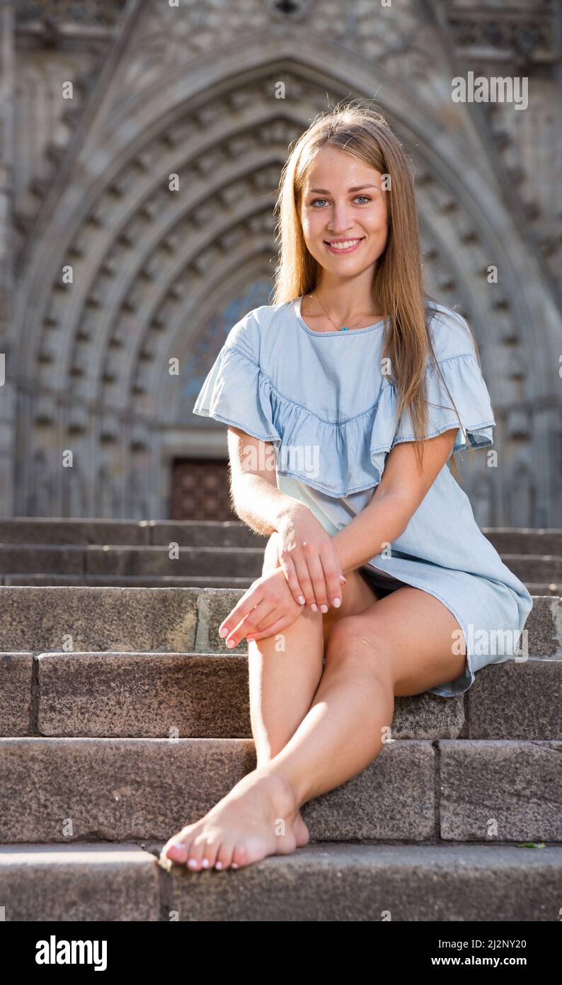 Girl Sitting On Stairs Of Temple Stock Photo Alamy