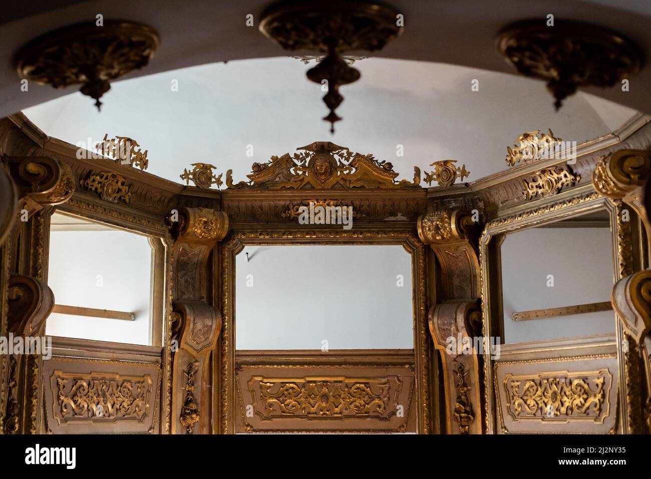 an old gothic gold frame wall decor in old architecture Stock Photo - Alamy