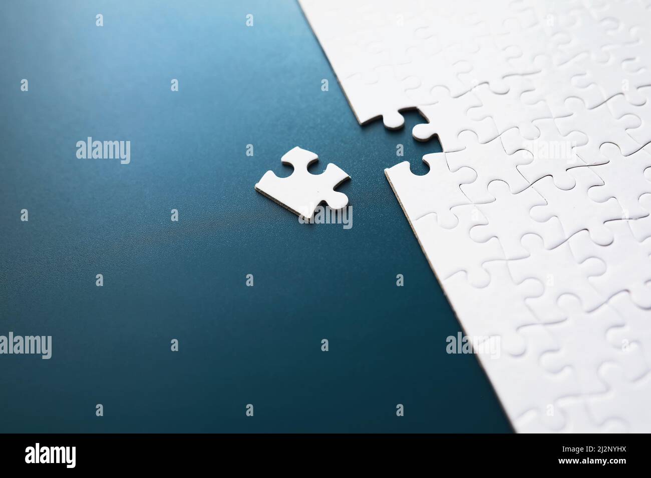 Intellectual puzzles. The puzzle empty. The hand puts together puzzle ...