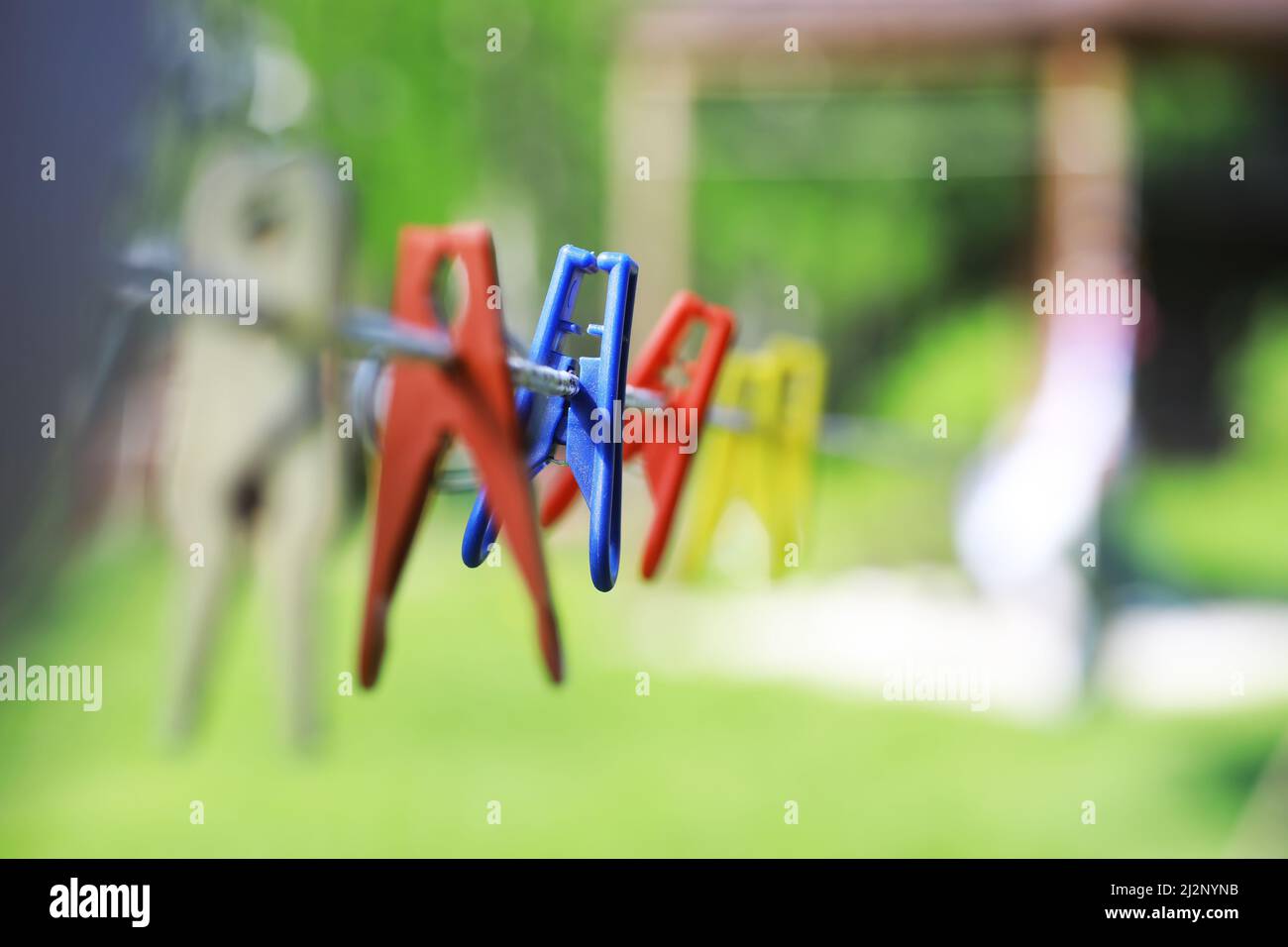 Clothespins on a clothesline in summer. Dry clothes outside. Clothes on ...