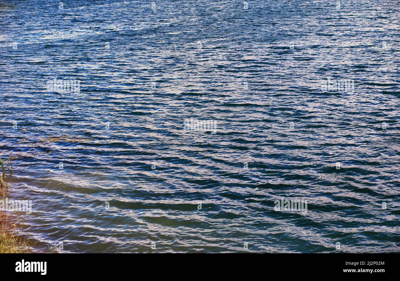 Water surface. The texture of the water. Waves on the lake windy ...