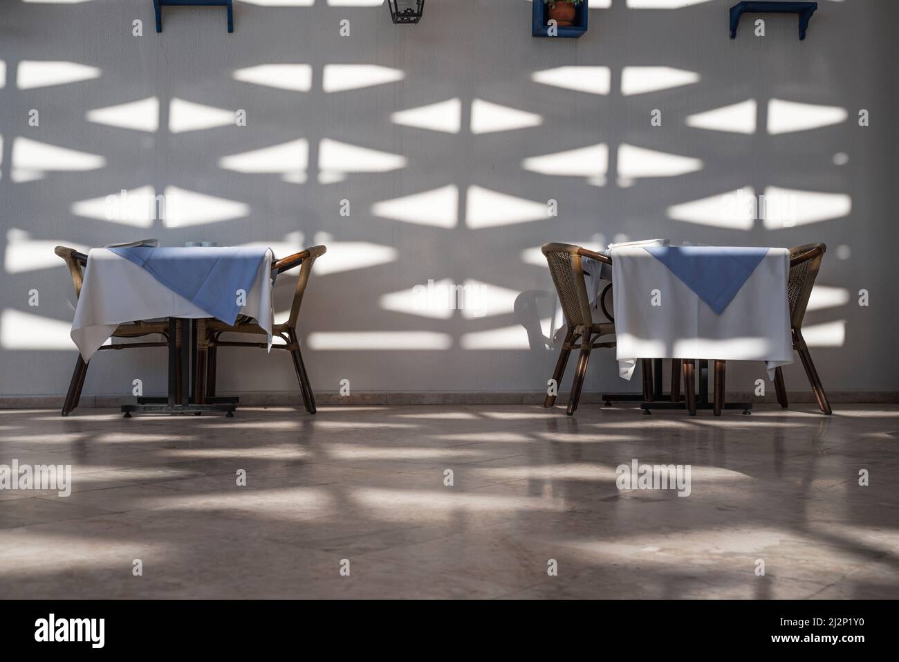 table under the shade in an open rooftop cafe-bar in the morning Stock ...