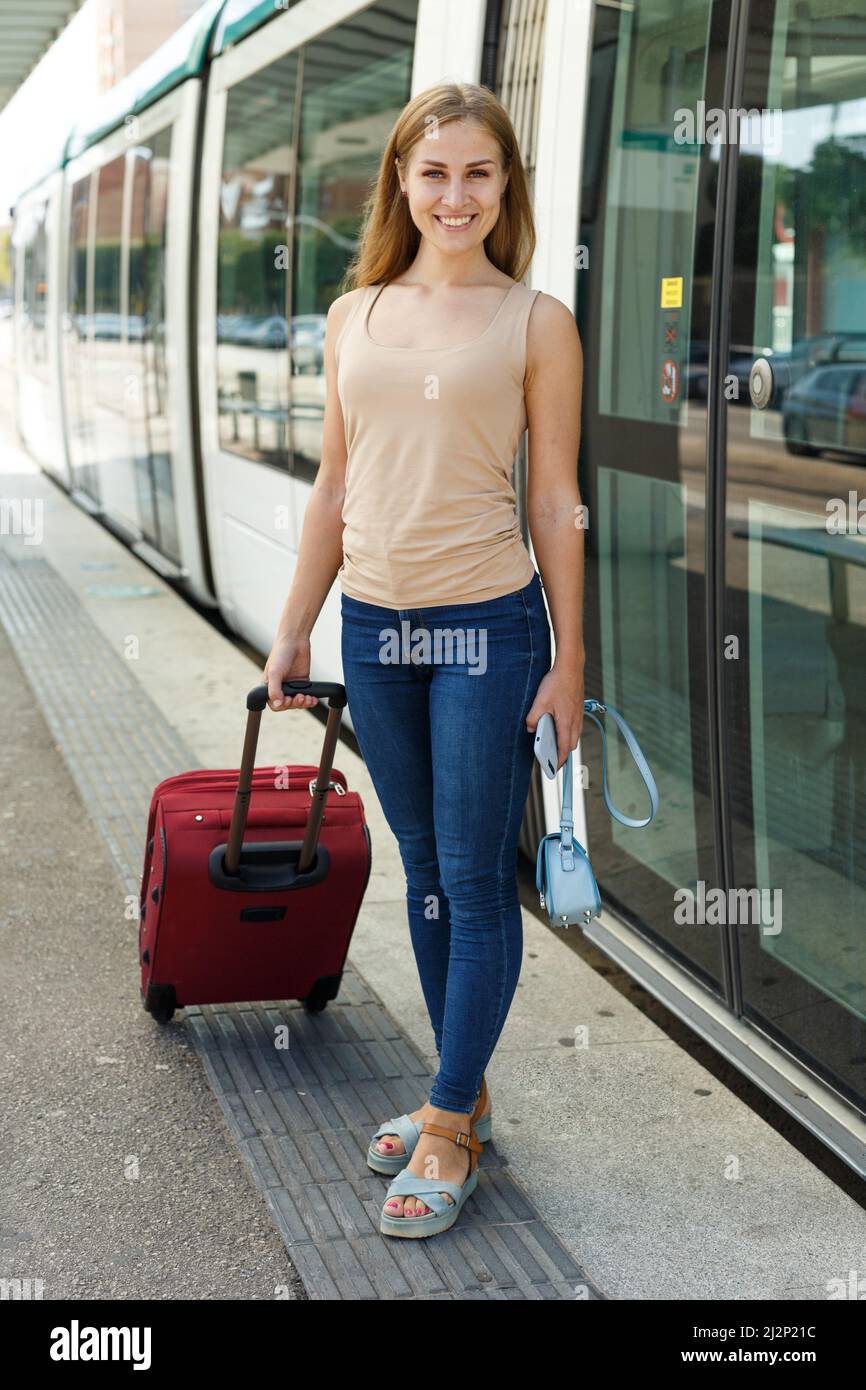 Woman leaving subway train Stock Photo - Alamy