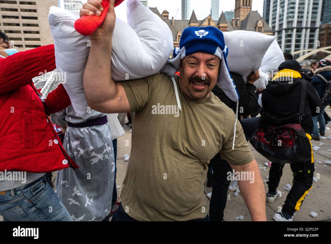 Kfir Lavi, the organizer of a community pillow fight, is hit by a ...