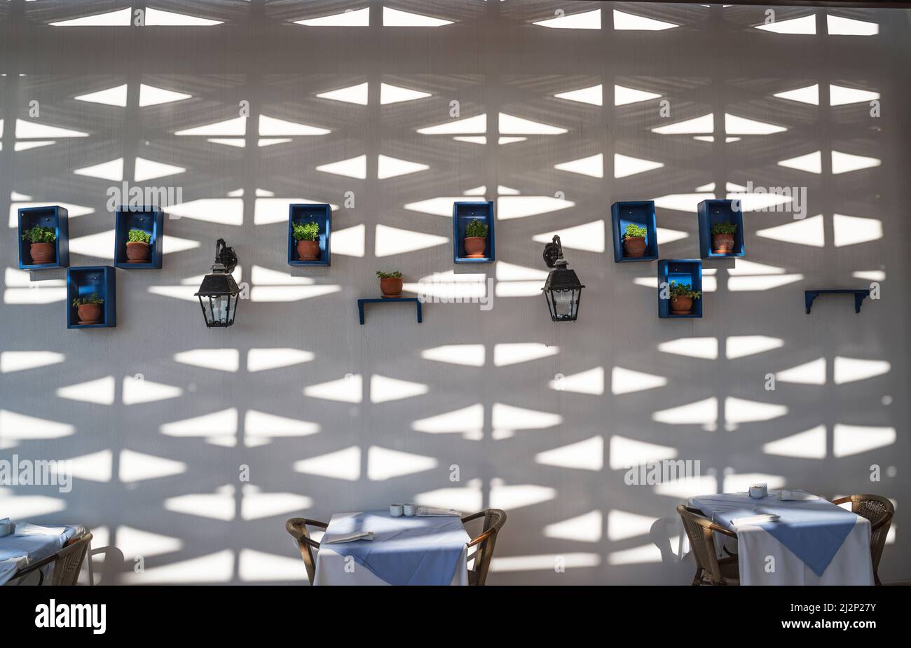 table under the shade in an open rooftop cafe-bar in the morning Stock ...