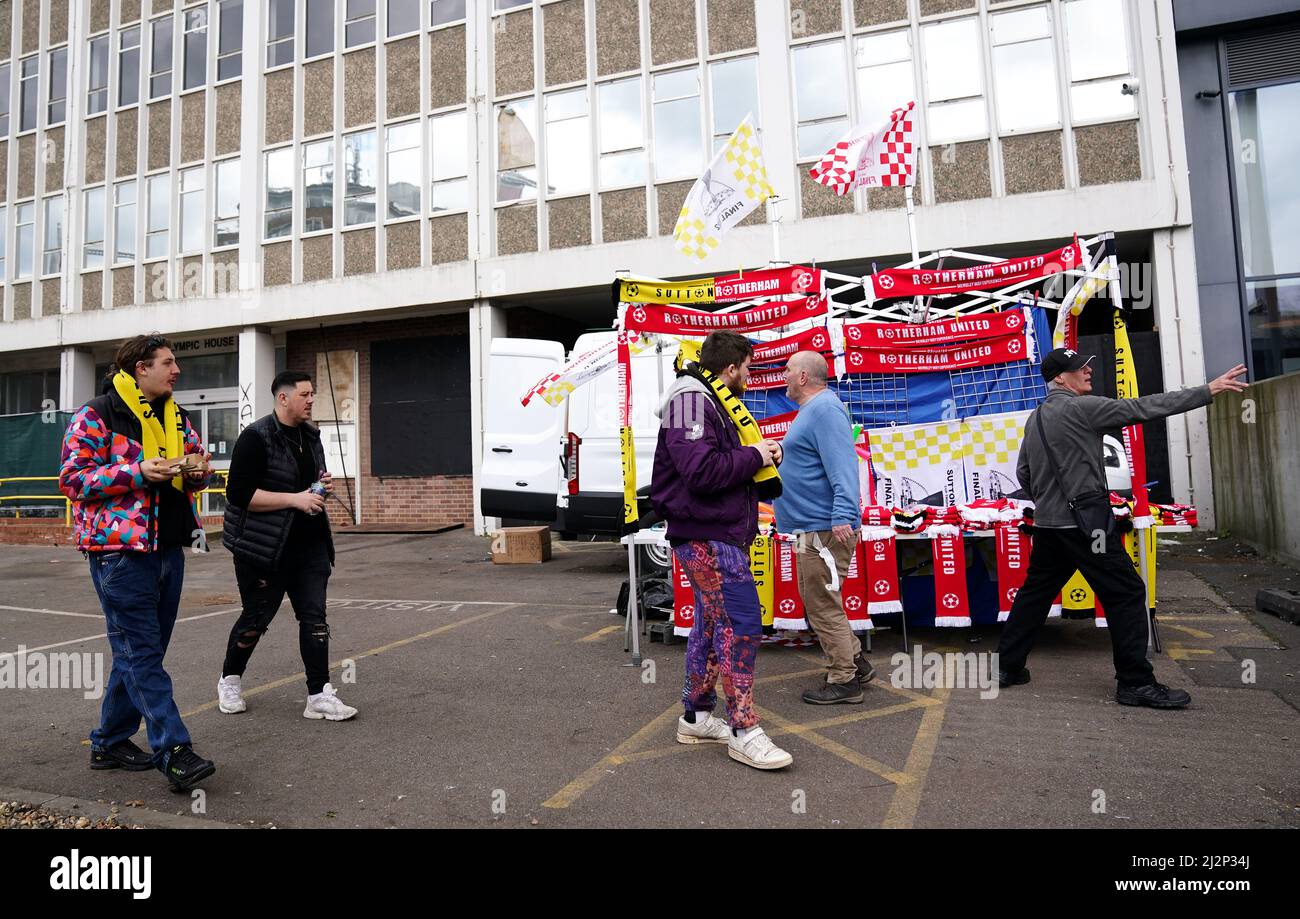 Sutton United fans walk past a merchandise stall before the Papa John's ...
