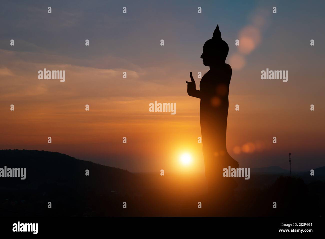 Silhouette of buddha statue at sunset sky background. Buddhist holy ...