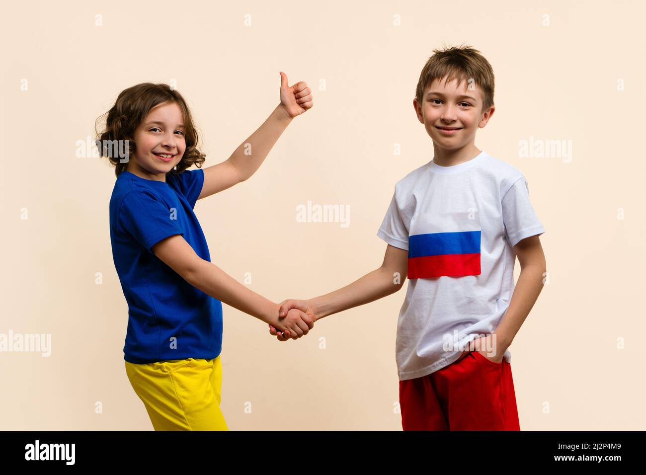 Boy and girl shake hands hi-res stock photography and images - Alamy