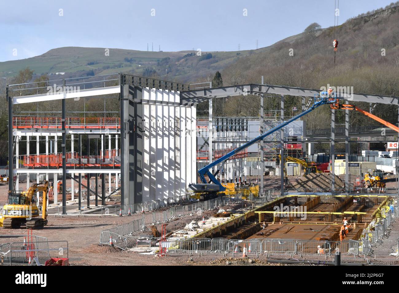 Taffs Well, near Cardiff, Wales - March 2022: Mobile crane lifting ... Taffs Well, near Cardiff, Wales - March 2022: Mobile crane lifting ...