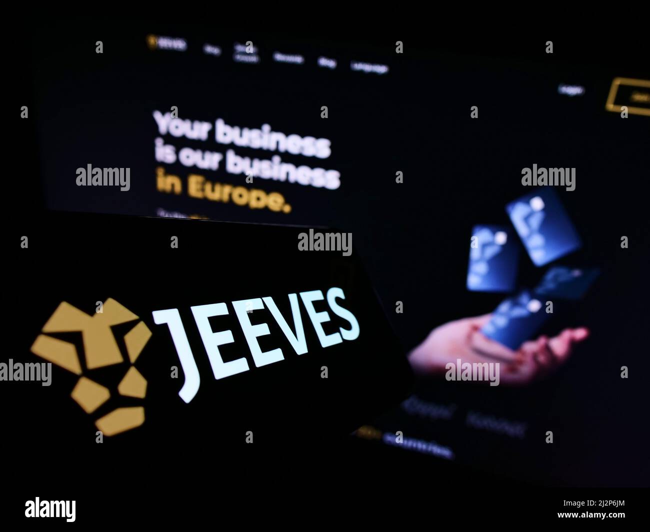 Smartphone with logo of US fintech company Jeeves Inc. on screen in ...