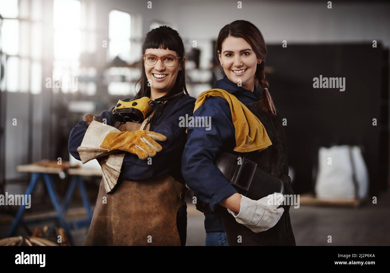 We create art from metal. Cropped portrait of two attractive young ...
