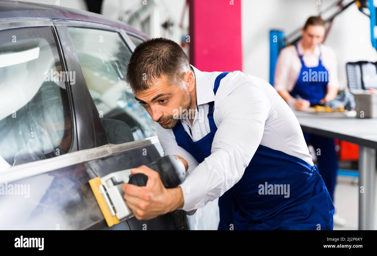Car mechanic sanding hi-res stock photography and images - Alamy
