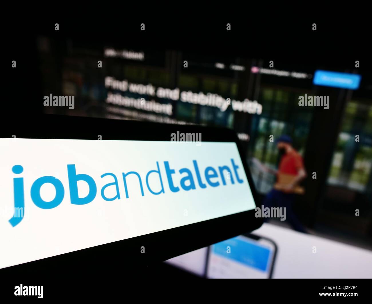 Mobile phone with logo of company Jobs and Talent S.L. (Jobandtalent ...