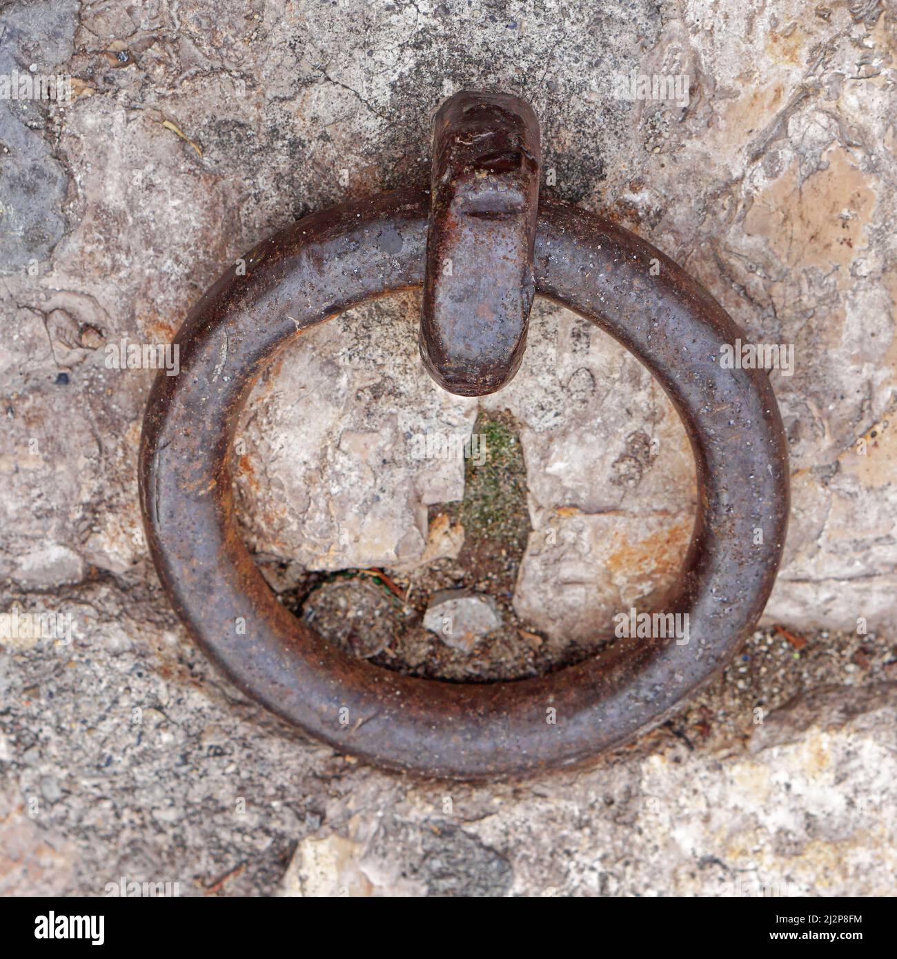 Iron ring for ship mooring in harbor France Stock Photo - Alamy