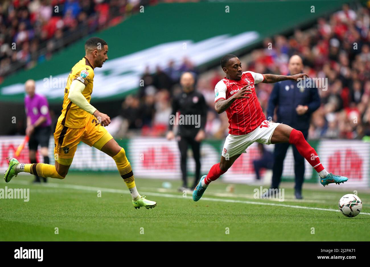 Sutton United's Joe Kizzi (left) presses Rotherham United's Mickel ...