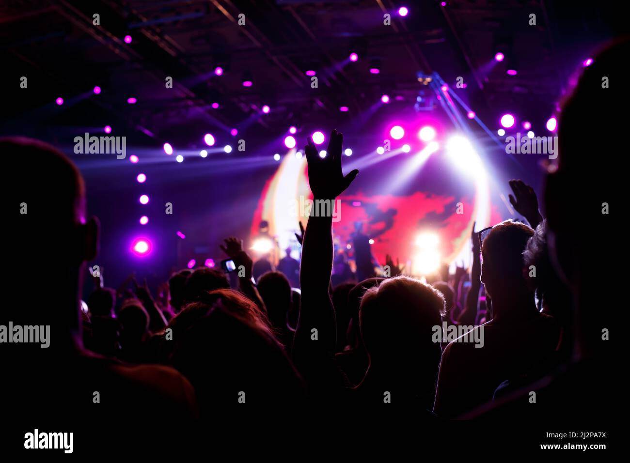 Rock concert, silhouettes of happy people raising up hands Stock Photo ...