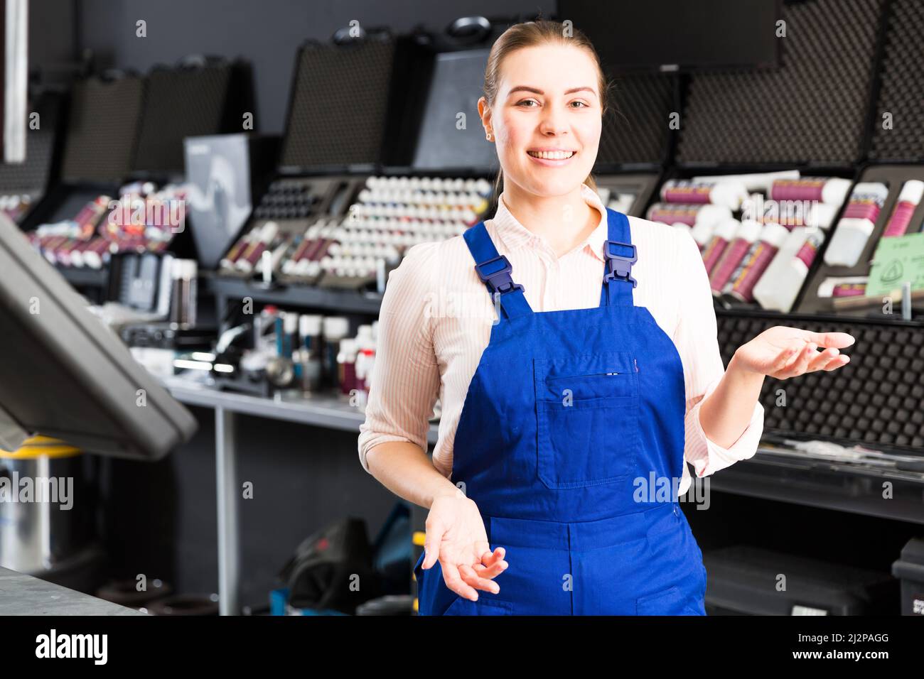 Girl in workwear meeting clients Stock Photo - Alamy