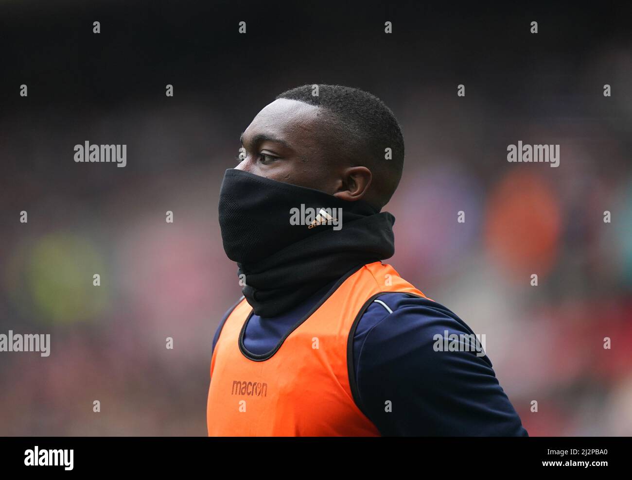 Sutton United's Isaac Olaofe warming up pitch side during the Papa John ...