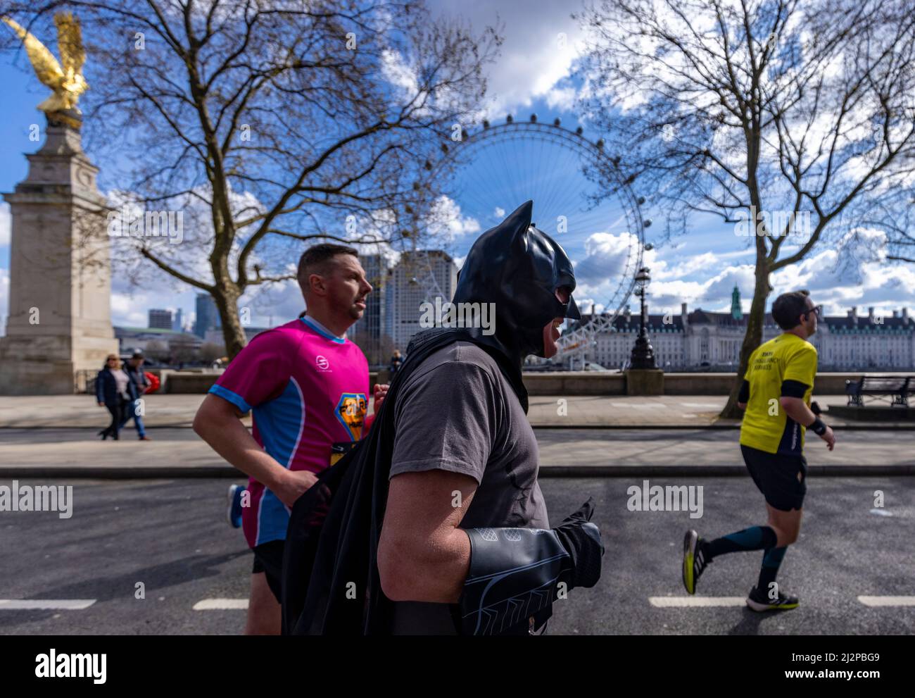 A runner dressed up as Batman going past the the London Eye during the ...