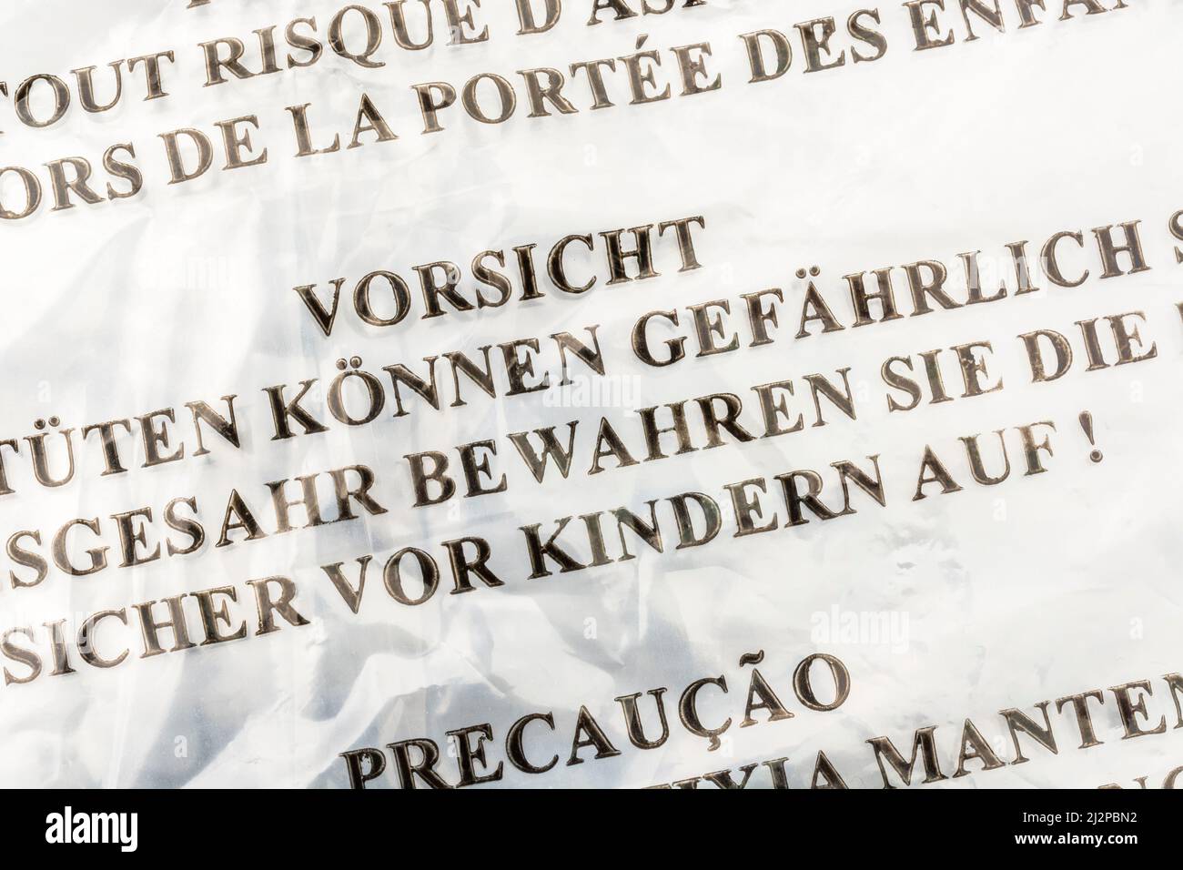 Suffocation warning in different languages hi-res stock photography and ...
