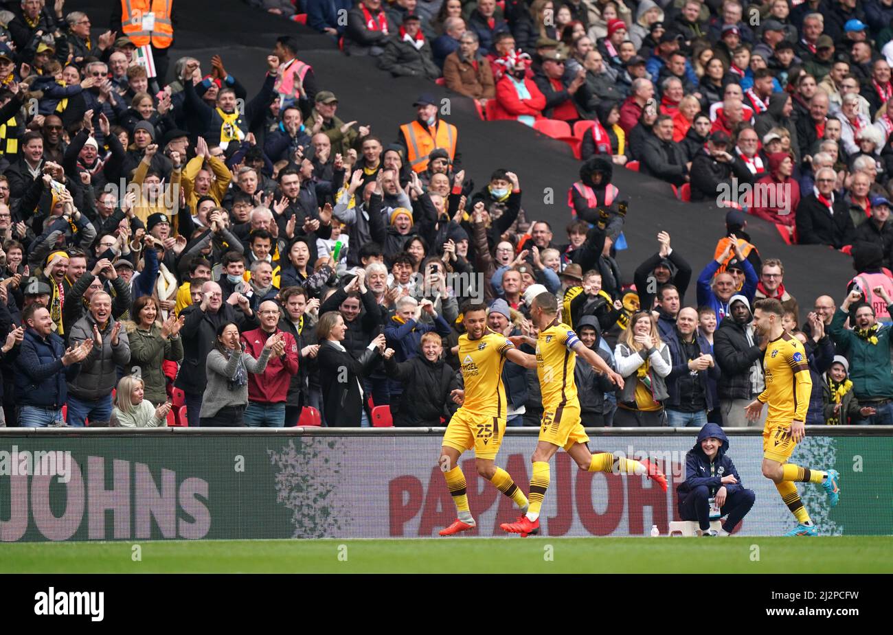 Sutton United's Donovan Wilson (left) celebrates scoring their side's ...