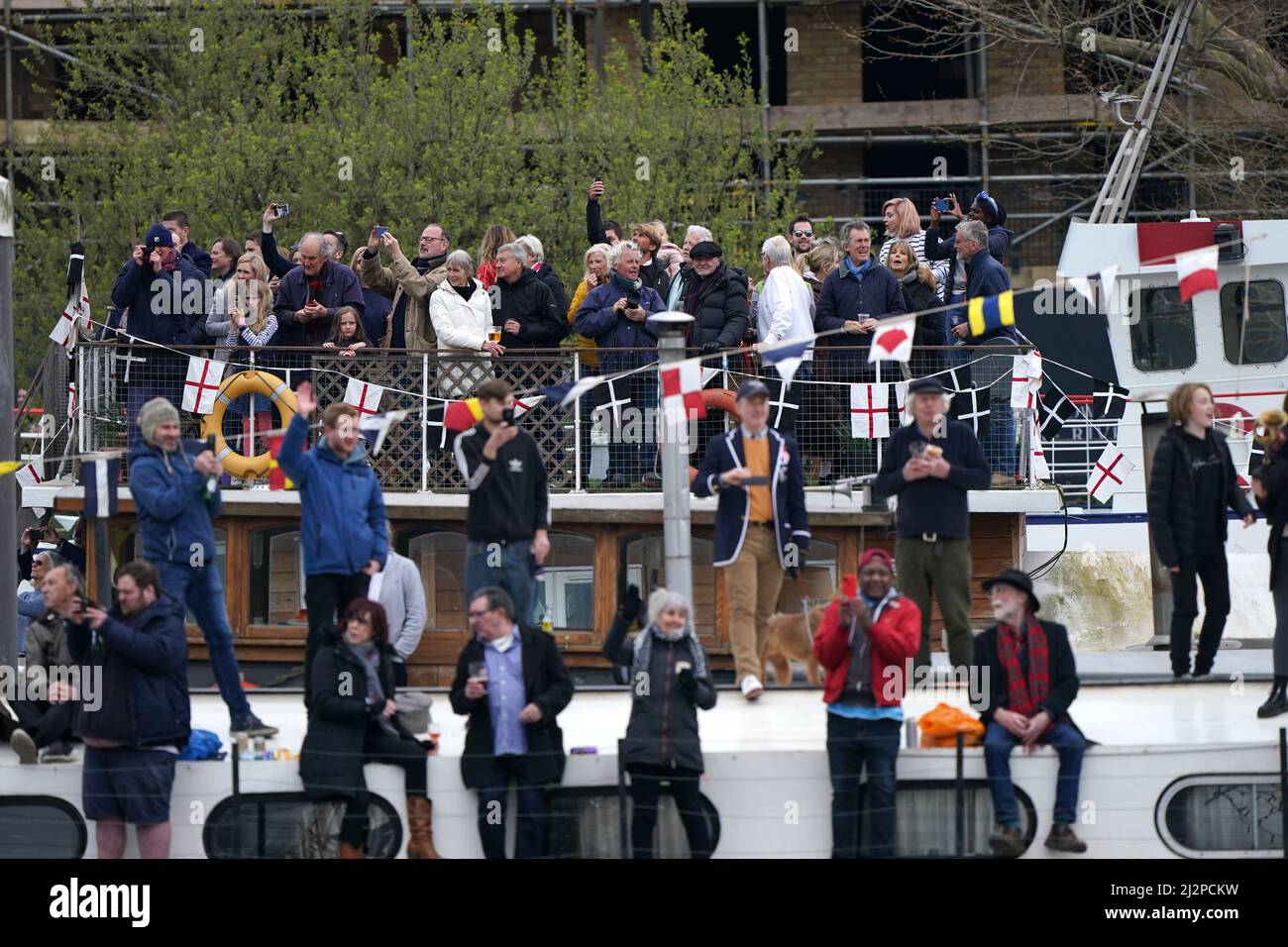 Fans watch the action during the 167th Men's Boat Race on the River ...