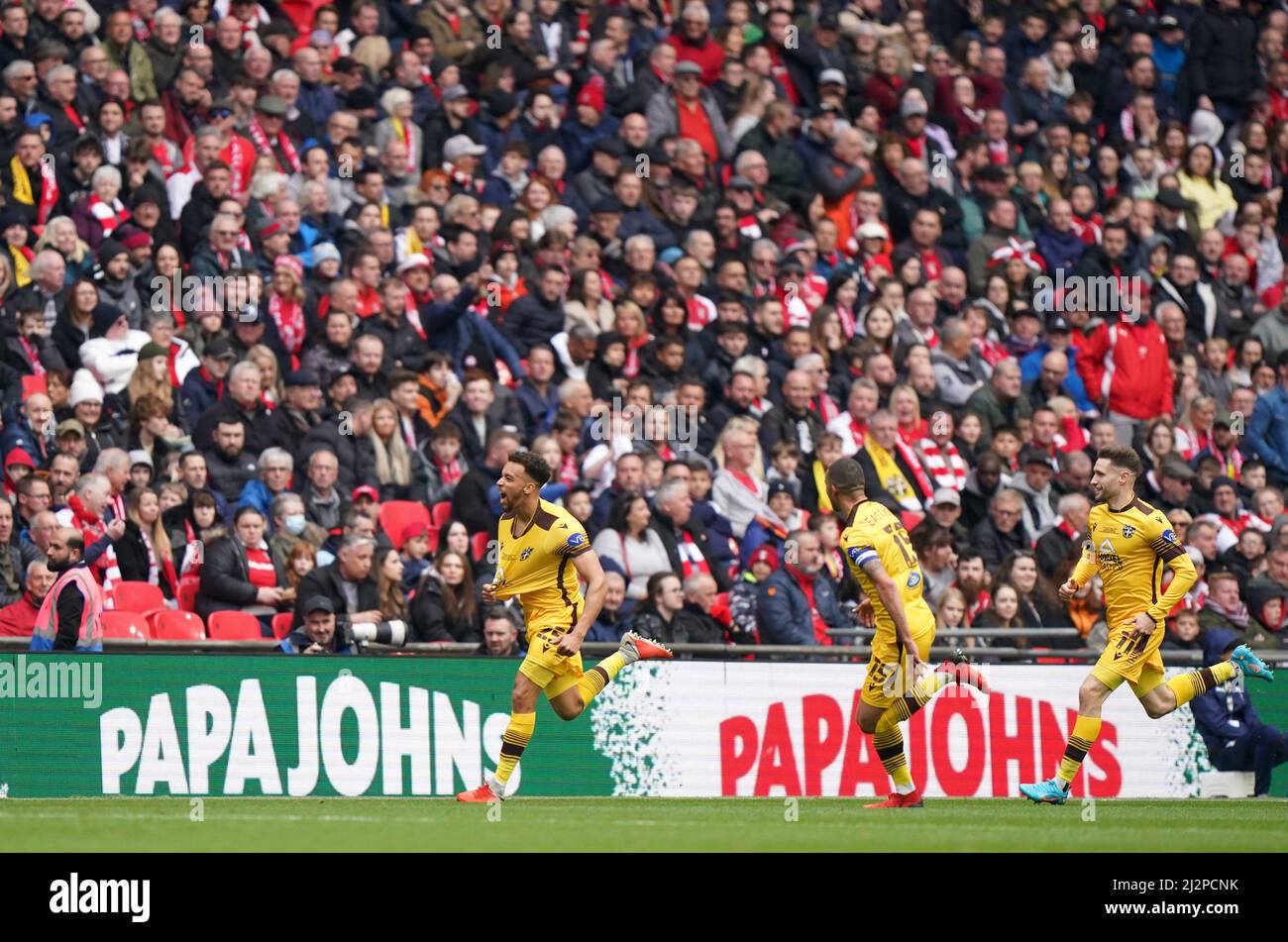 Sutton United's Donovan Wilson (left) celebrates scoring their side's ...