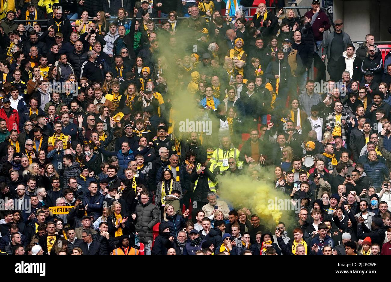 Sutton United fans set of yellow smoke during the Papa John's Trophy ...