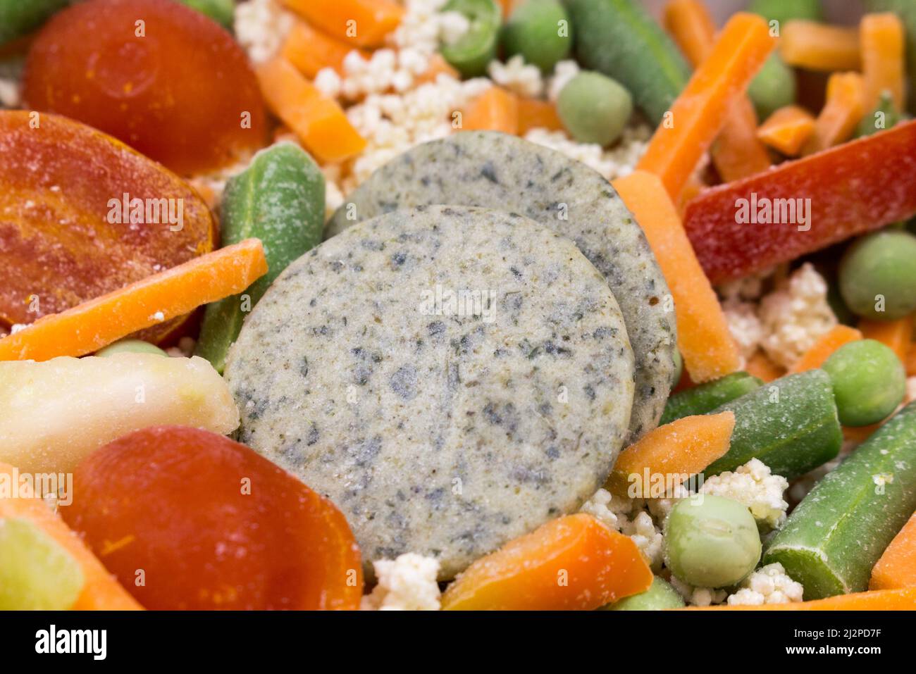 Frozen mix of couscous, vegetables and sauce for quick preparation ...