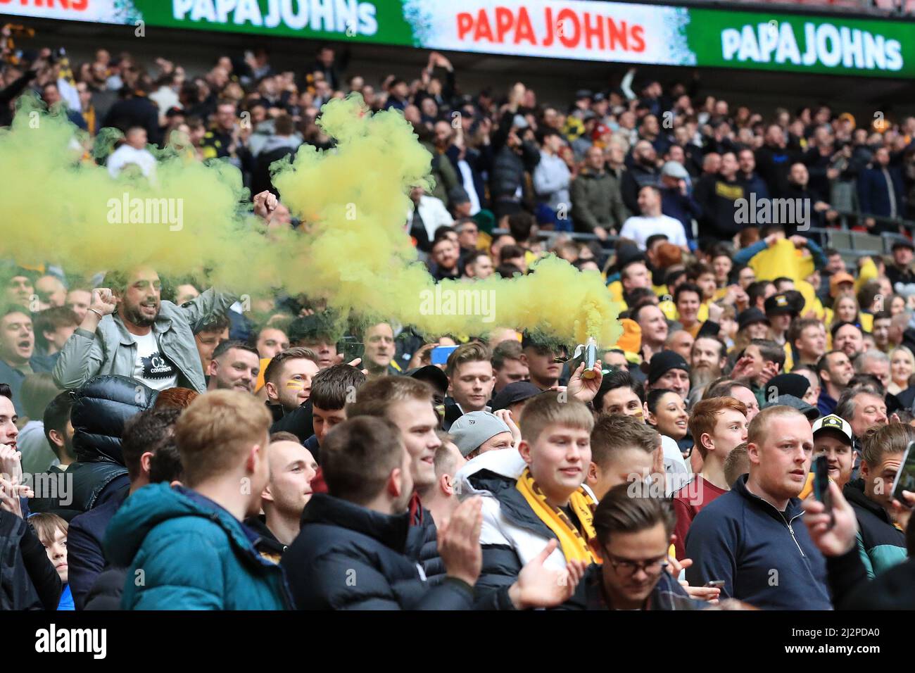 London, UK. 03rd Apr, 2022. Sutton United fans break out the flare ...