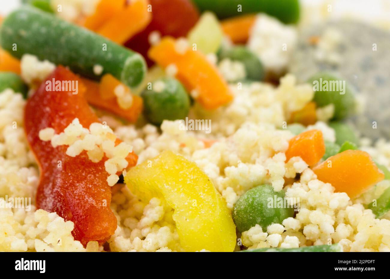 Frozen mix of couscous, vegetables and sauce for quick preparation ...