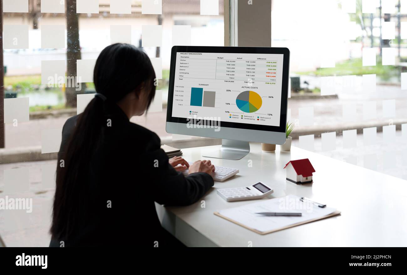 Close up real estate business woman working with pc computer for ...