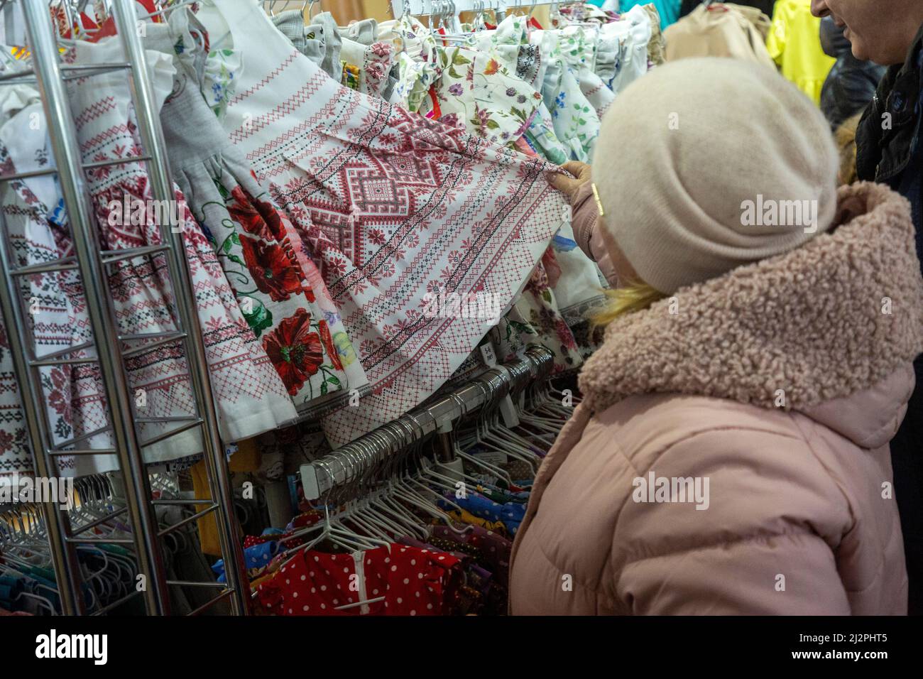 Moscow, Russia. 3rd of April, 2022. A woman looks at children's clothes ...