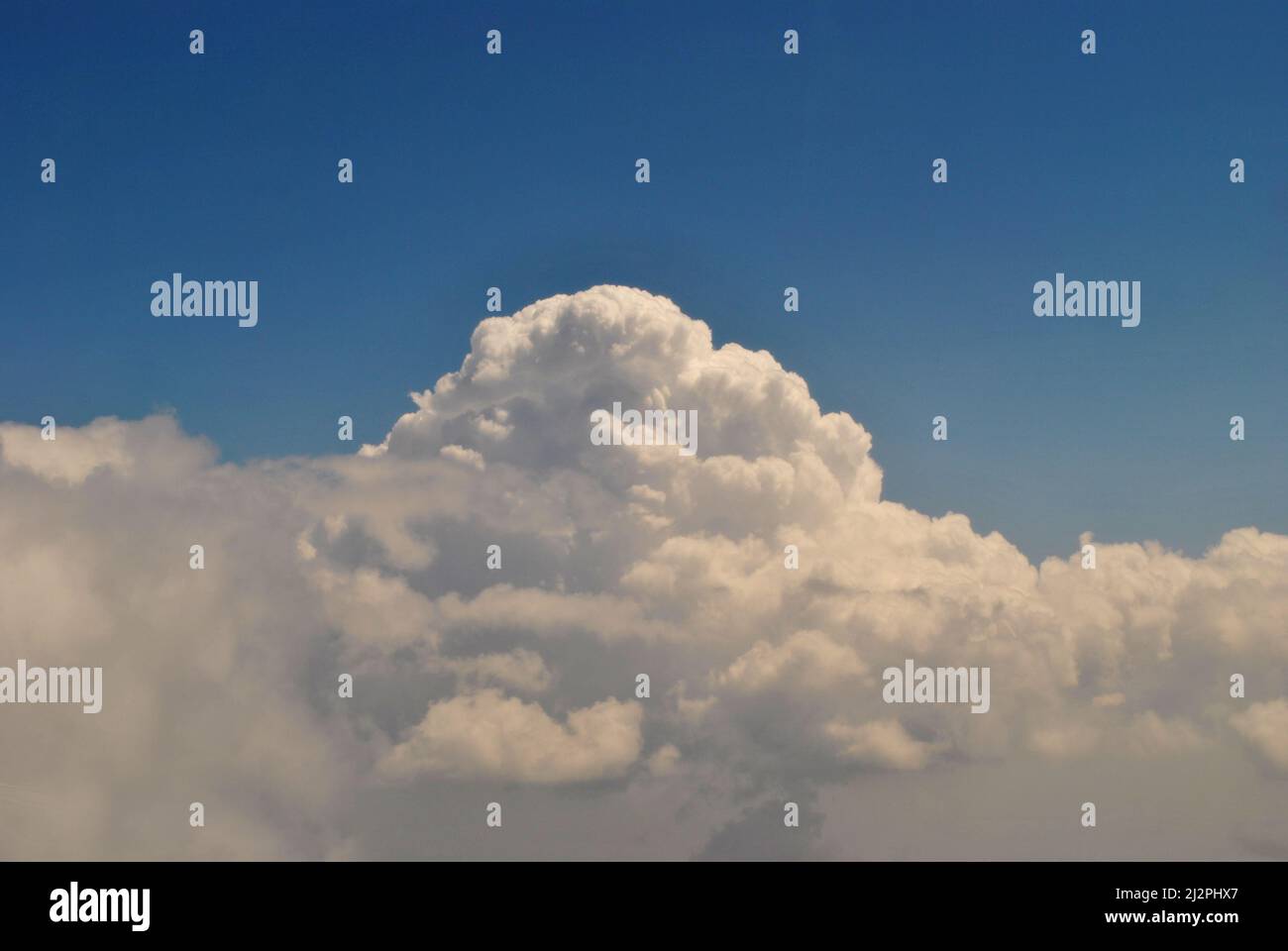 Saturated color of the blue sky with white clouds Stock Photo - Alamy