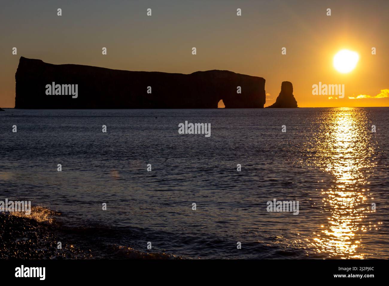Morning sunset on Rocher Perce rock in Gaspe Peninsula, Quebec ...