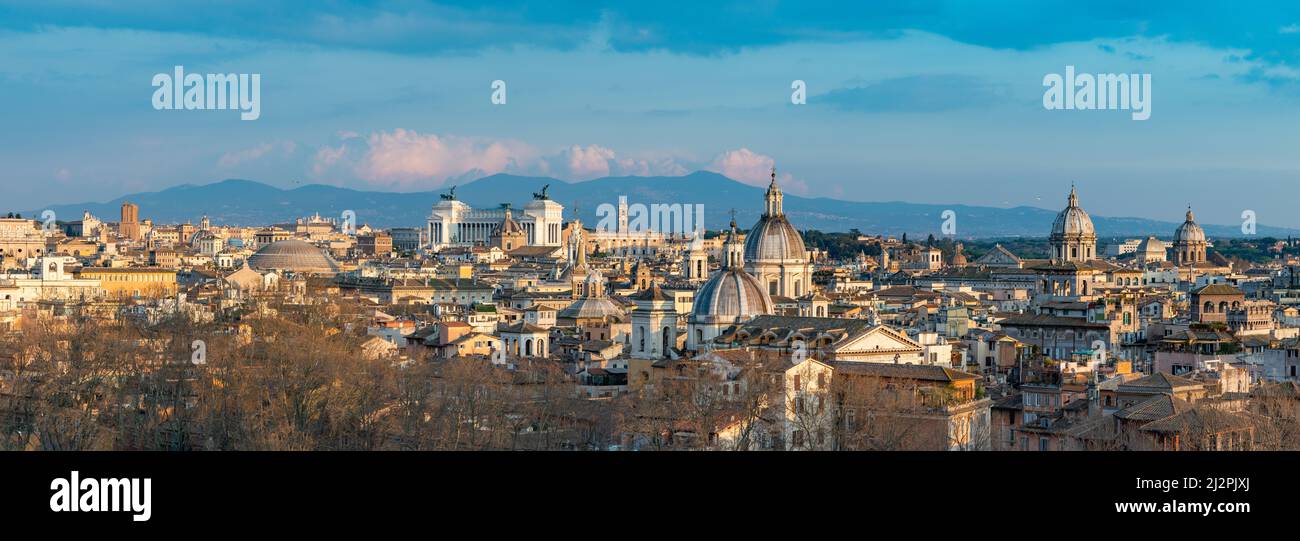 A panorama picture of the landmarks and rooftops of Rome at sunset ...