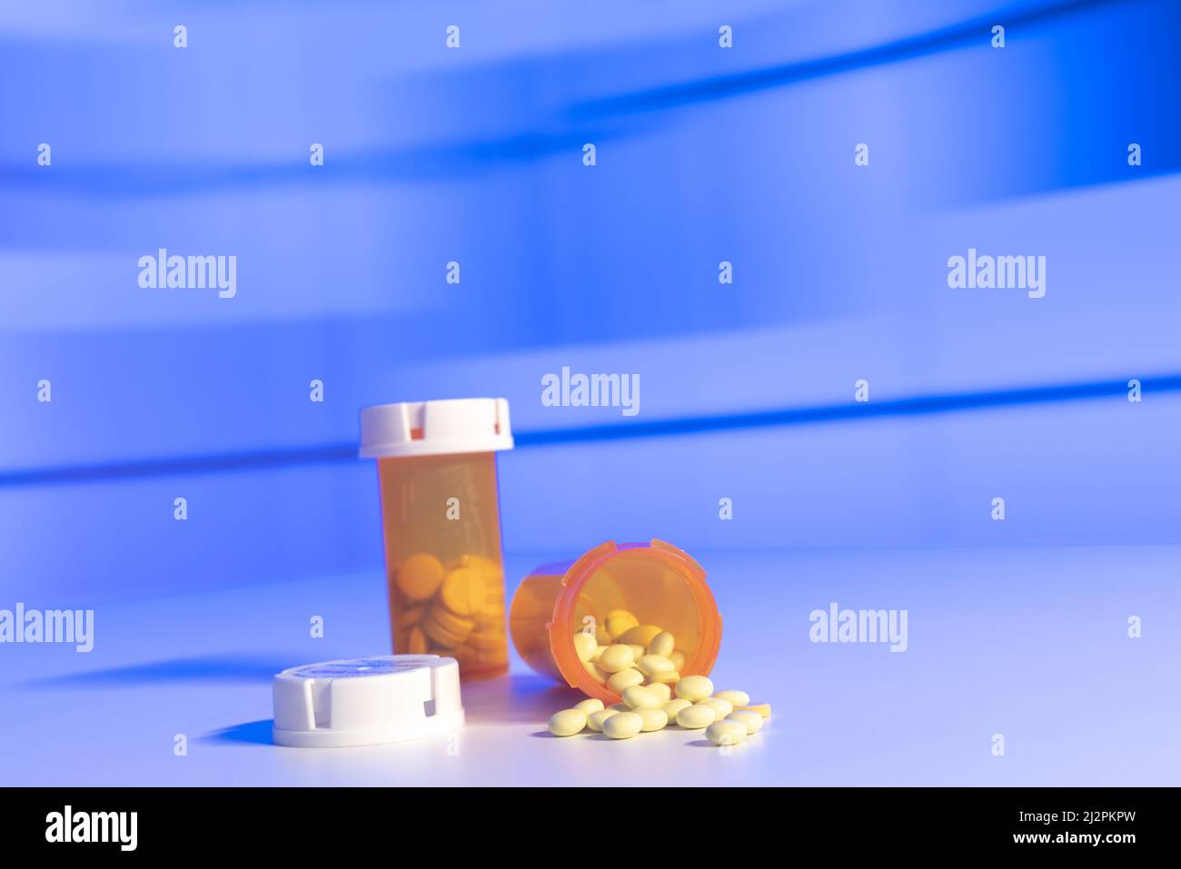 Colorful tablets with capsules and pills on blue background Stock Photo ...