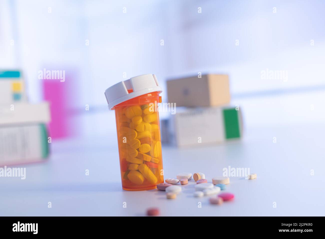 Colorful tablets with capsules and pills on blue background Stock Photo ...