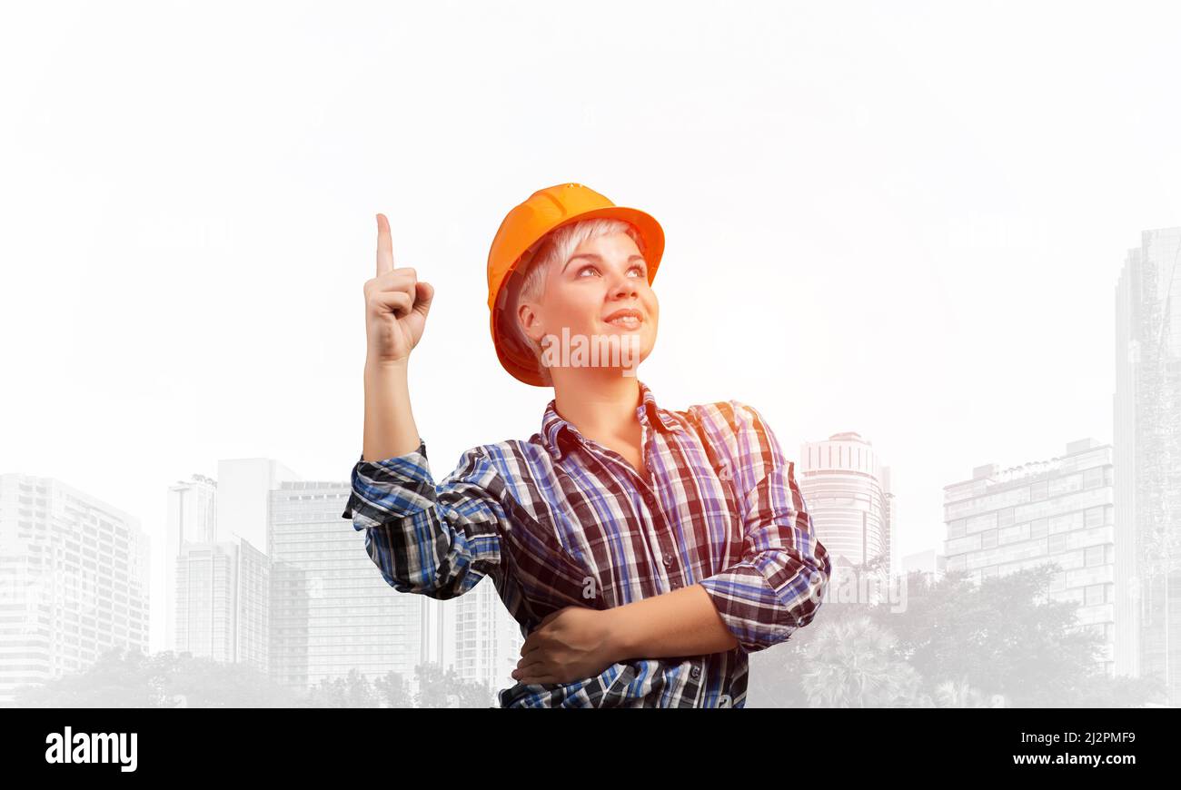 Beautiful female builder in hardhat Stock Photo - Alamy