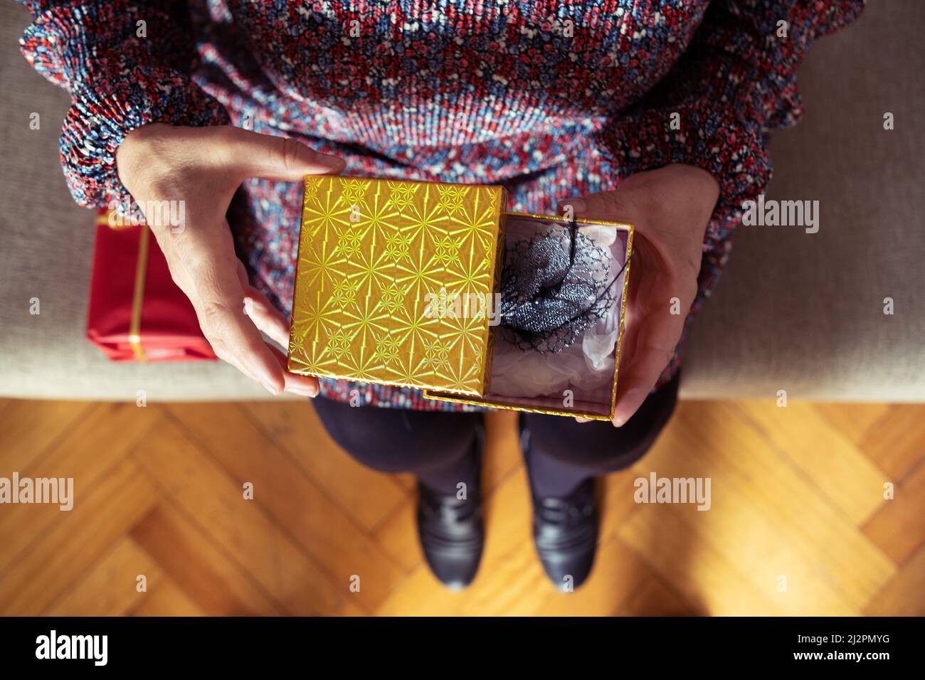 Person opening a gift hi-res stock photography and images - Alamy