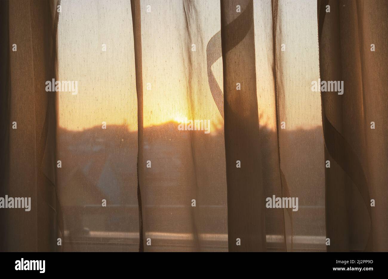 Sunset through curtain hi-res stock photography and images - Alamy
