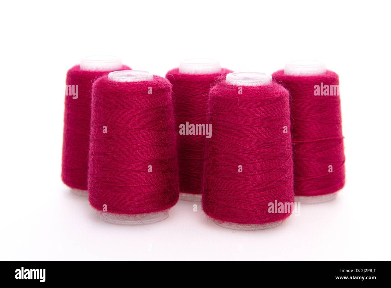 Red spool of thread isolated on white background. Skein of woolen ...